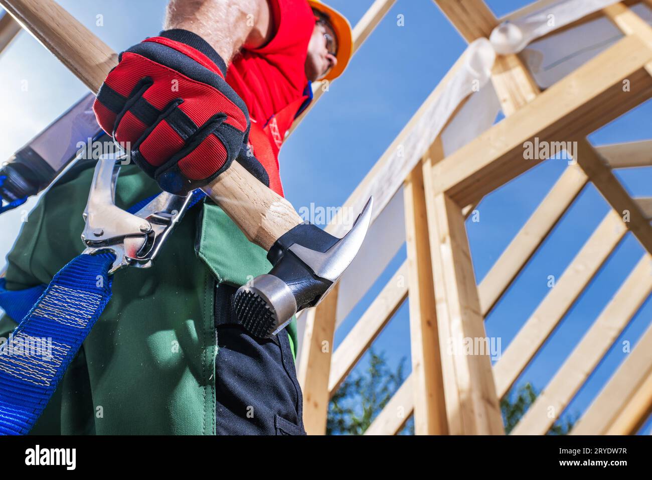 Construction Site Contractor with Large Hammer in His Hand. Wooden ...