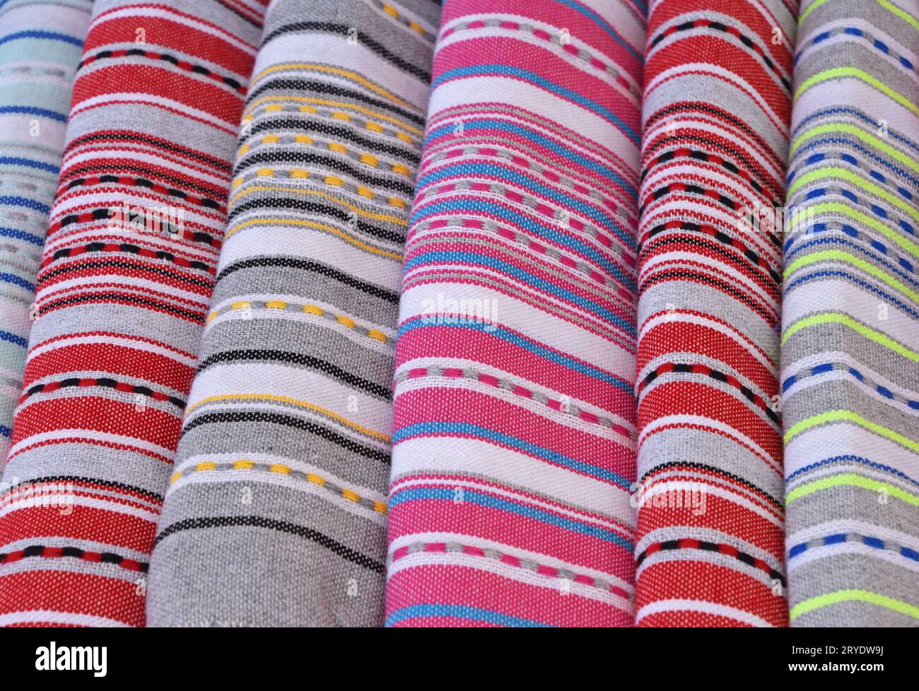 Linen towels and bedspreads on retail display Stock Photo - Alamy