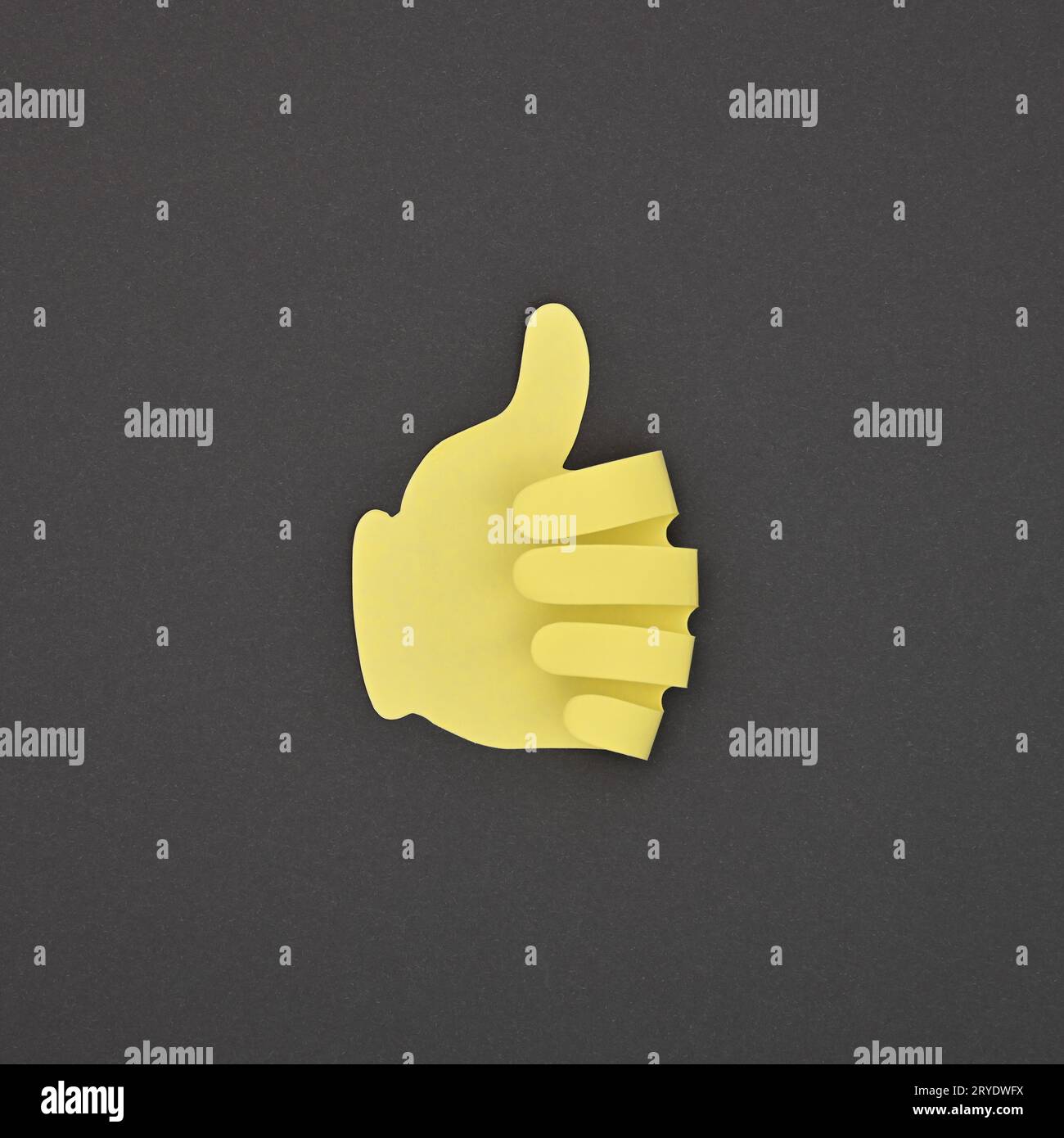Paper made yellow LIKE gesture sticker on grey Stock Photo - Alamy