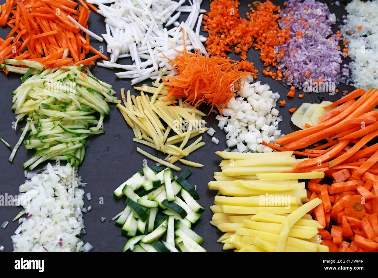 Assorted cut sliced vegetables on cooking board Stock Photo - Alamy