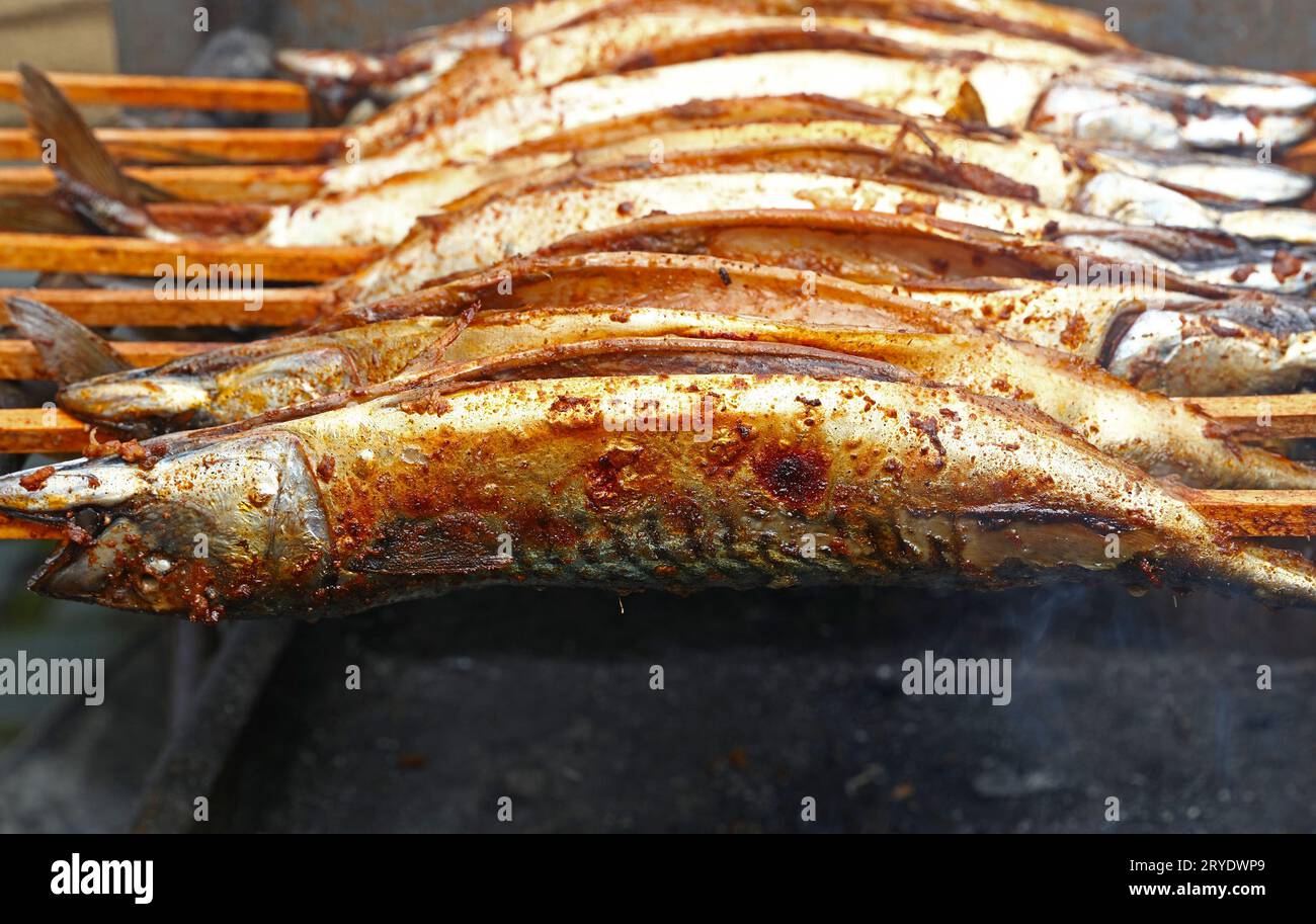 Cooking bonito mackerel fish on grill Stock Photo - Alamy