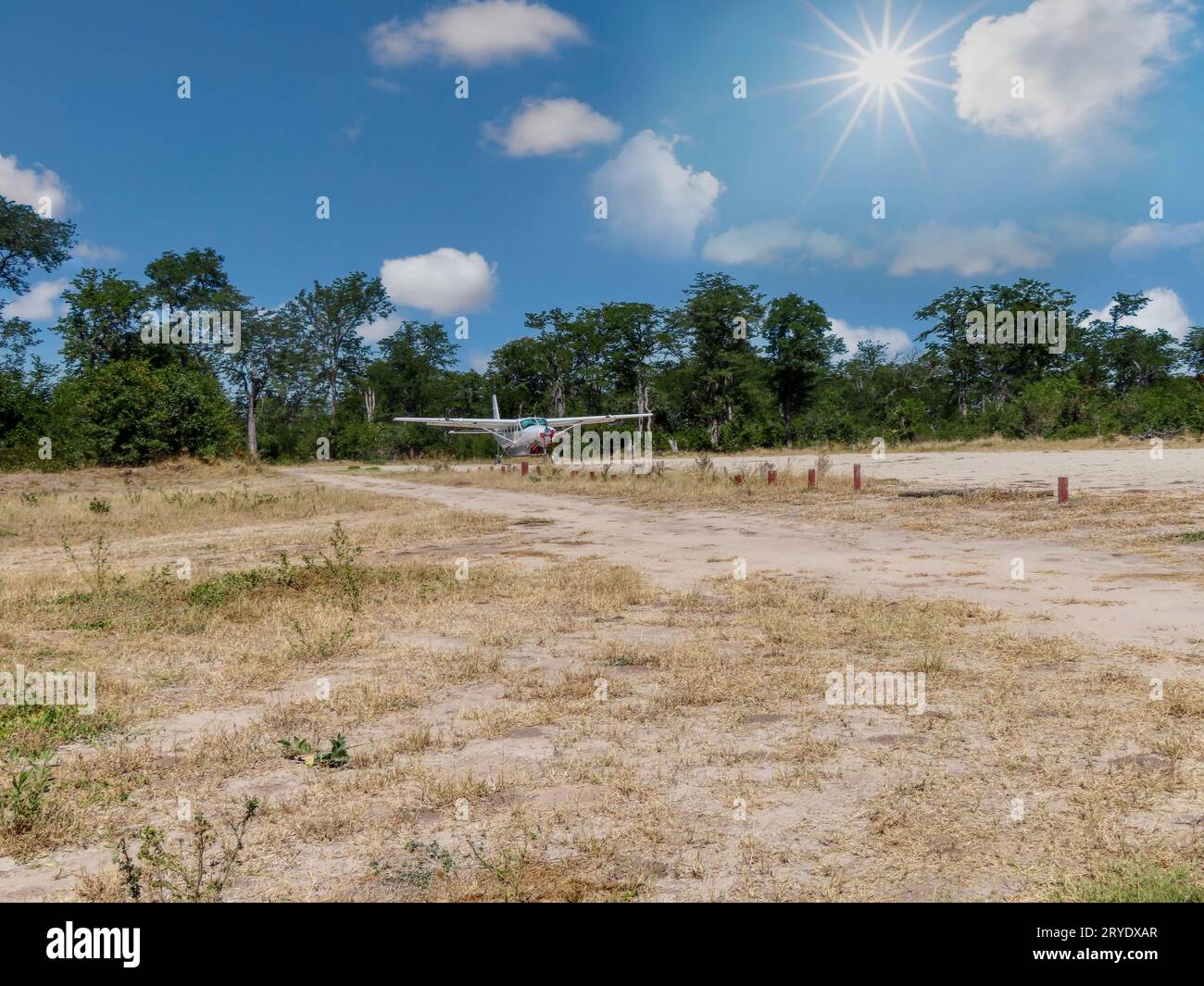 Okavango Delta in Botswana, bush airport on dirt track, plane ready to ...