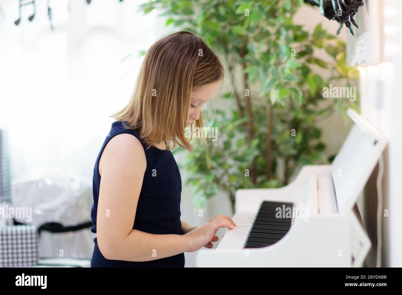 Child playing piano. Kids play music. Classical education for children ...