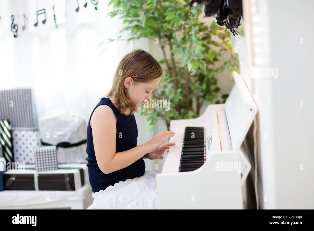 Child playing piano. Kids play music. Classical education for children ...