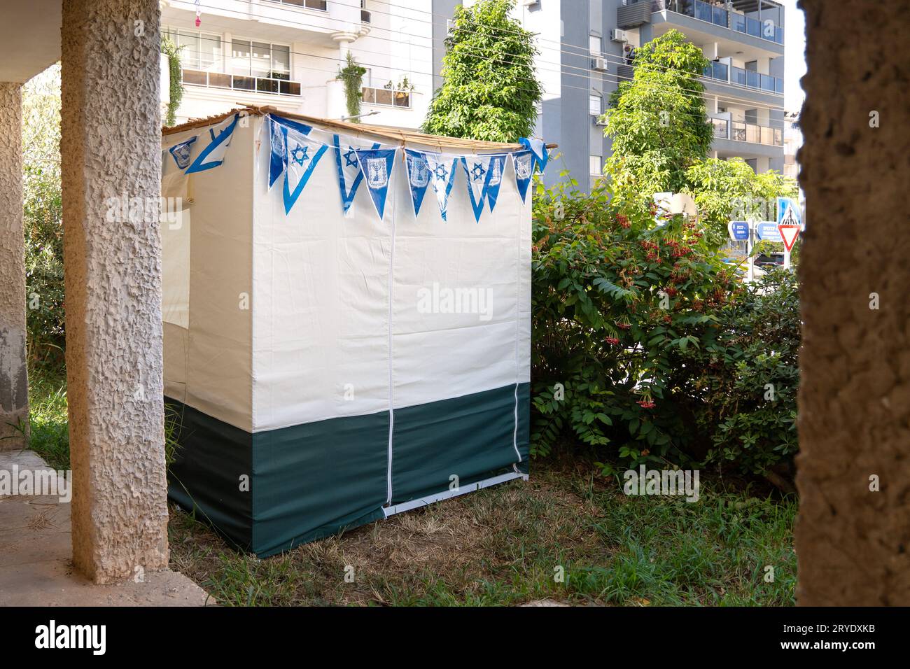 Sukkah in a yard of a residential building in Israeli town during ...