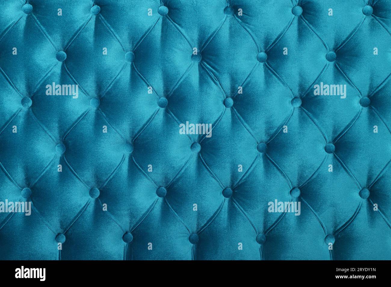 Teal blue capitone tufted fabric upholstery texture Stock Photo - Alamy