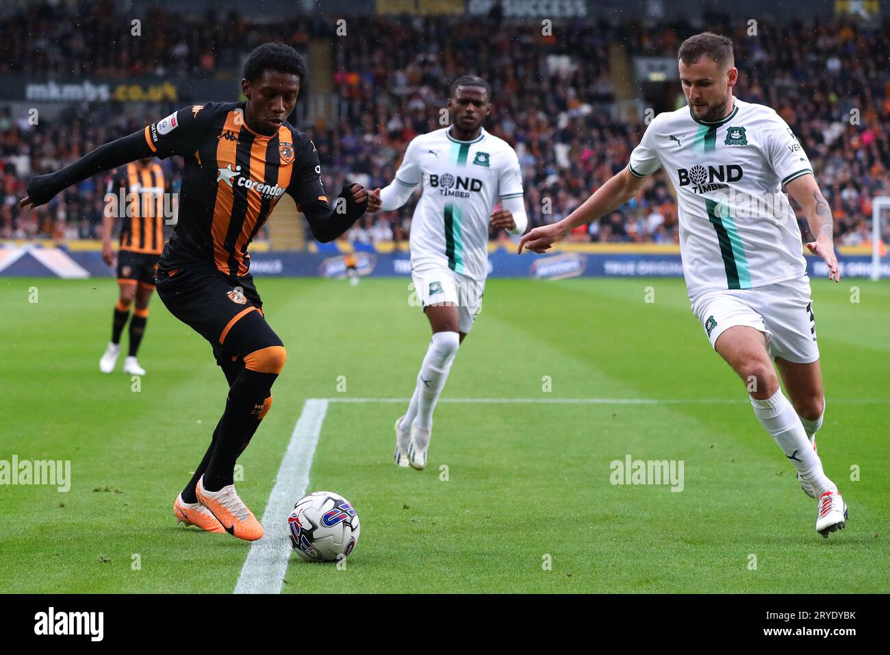Jaden Philogene of Hull City runs through the Plymouth Argyle defence ...