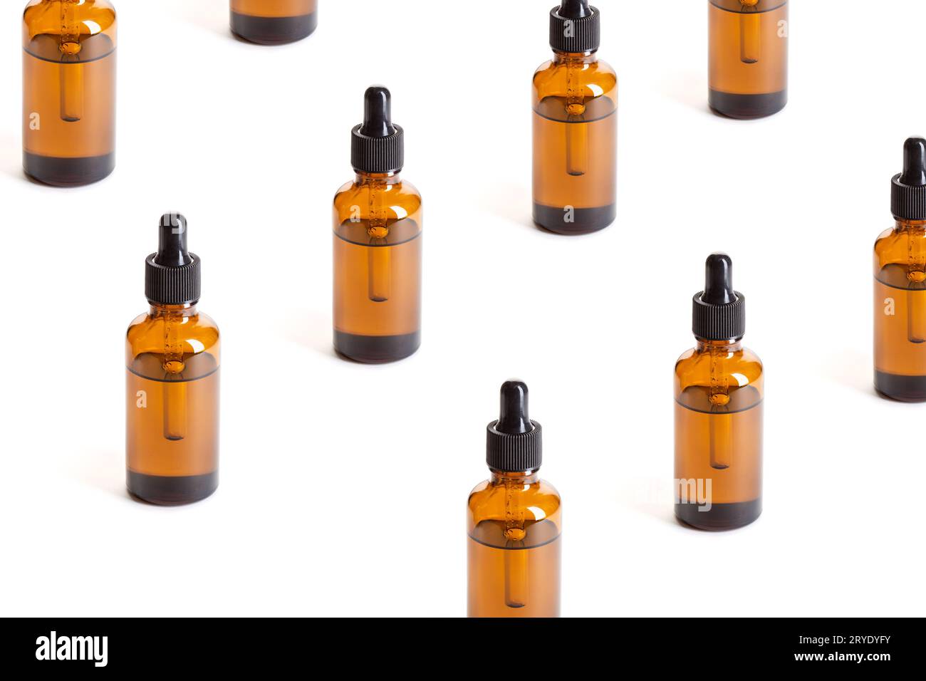 Pattern of Amber Bottles with dropper on white background Stock Photo ...