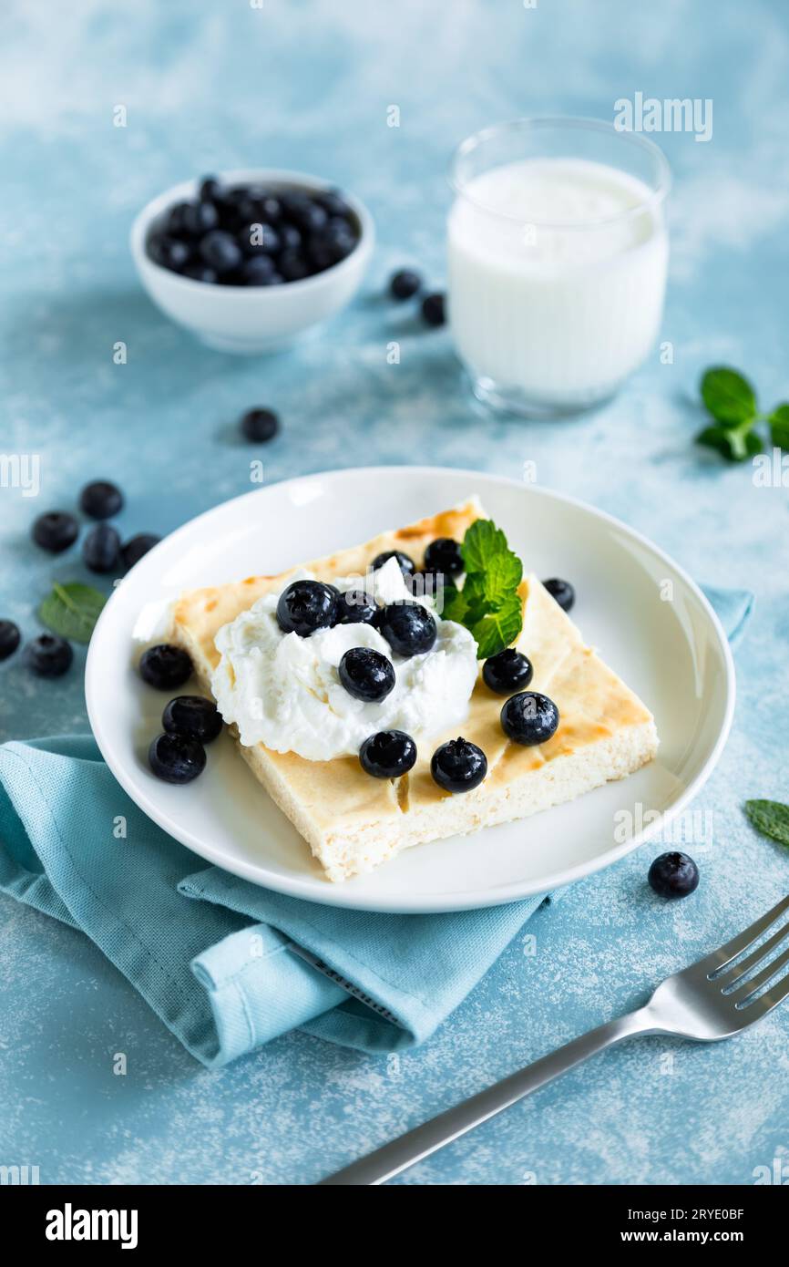 Cottage cheese cheesecake slice with fresh blueberry Stock Photo - Alamy