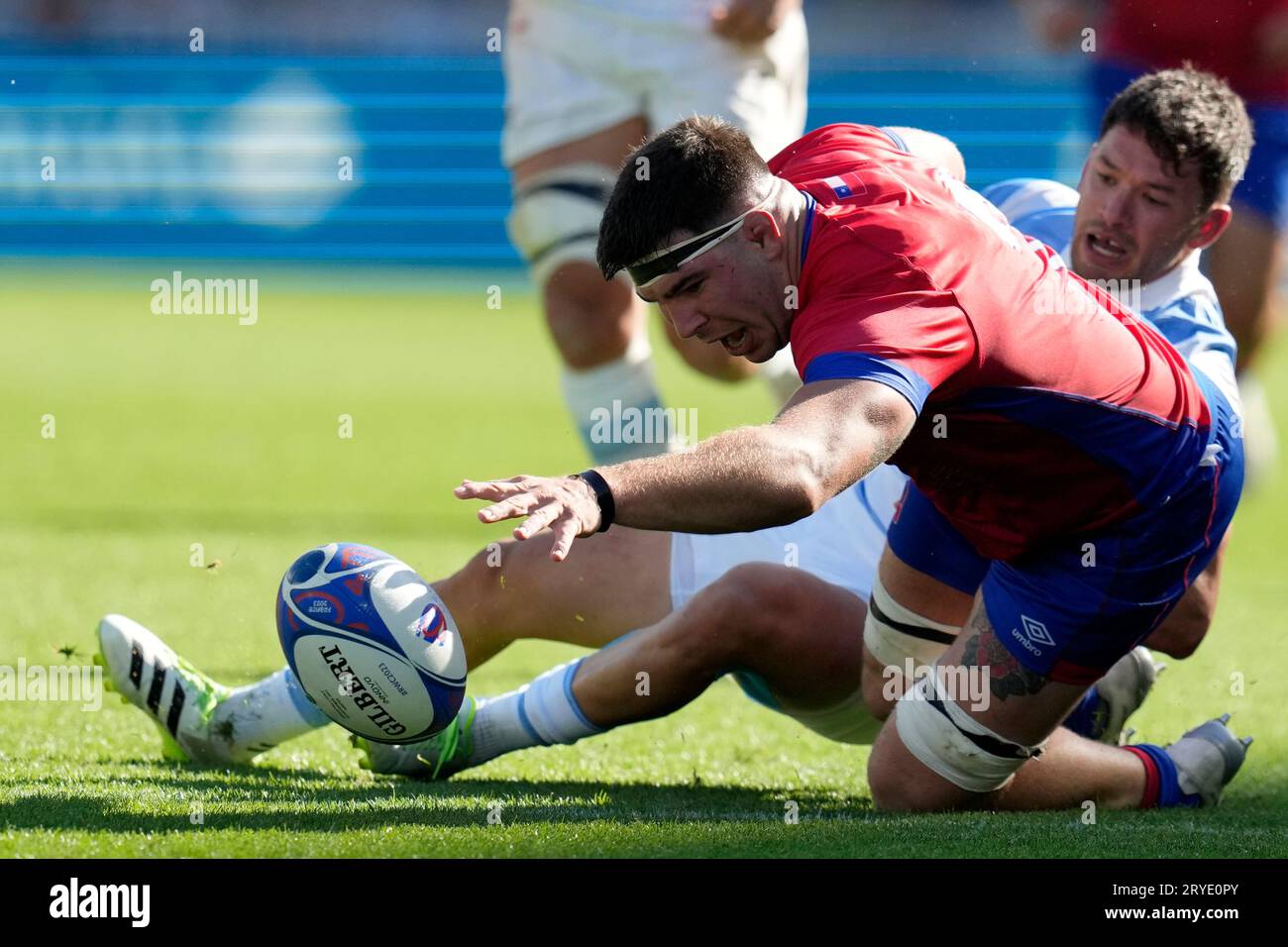 Chile's Clemente Saavedra, front, is spills the ball after being ...