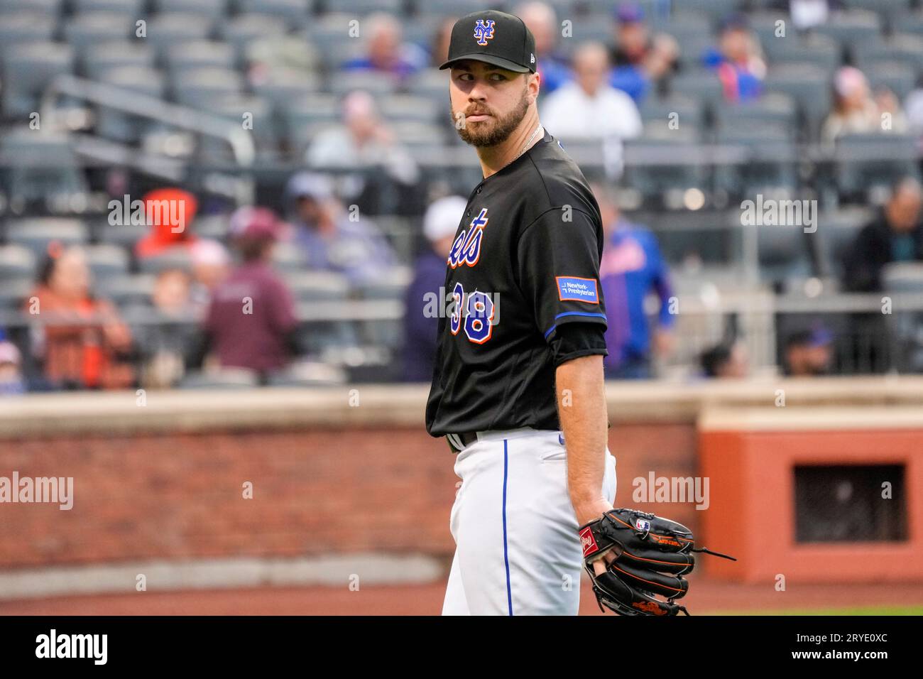 New York Mets pitcher Tylor Megill walks off the field during the ...