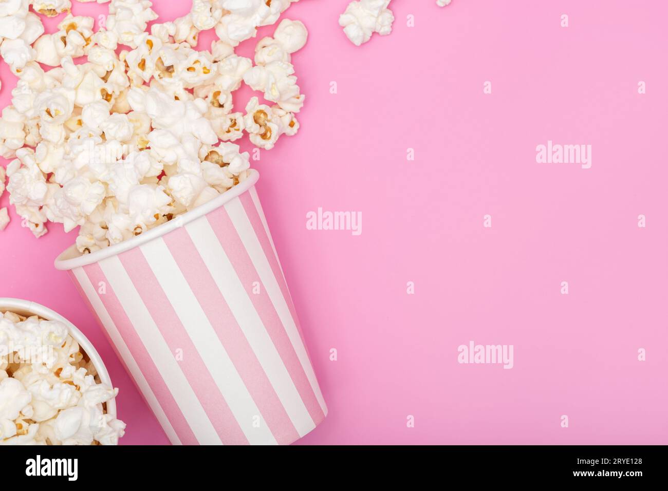 Popcorn bucket on pink background Stock Photo - Alamy