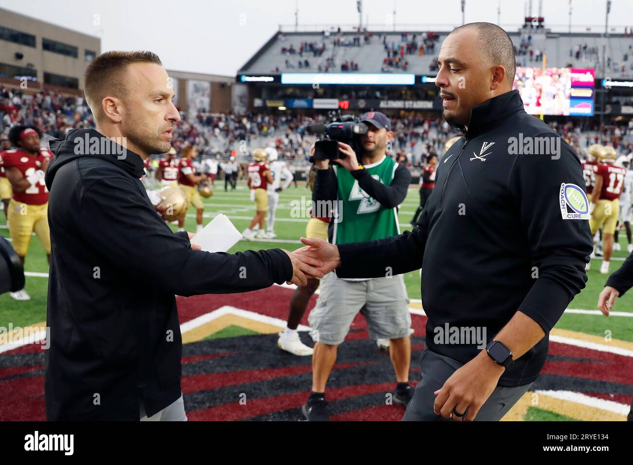 Boston College head coach Jeff Hafley, left, and Virginia head coach ...