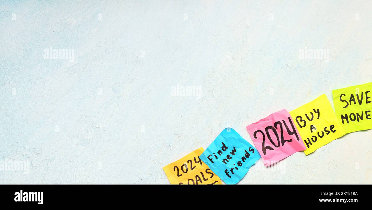 Note papers with written goals for new year 2024 on light background ...