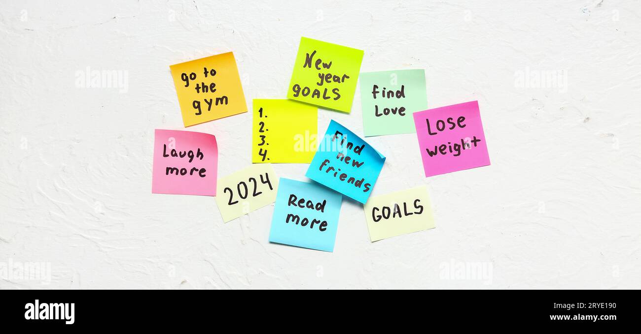 Note papers with written goals for new year 2024 on light background ...