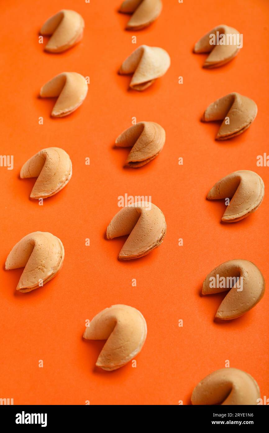 Fortune cookies on orange background Stock Photo - Alamy