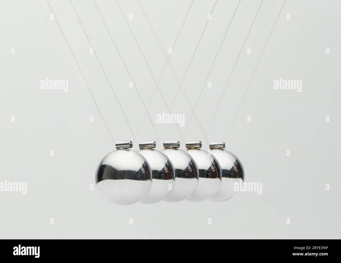 Pendulum on a white background Stock Photo - Alamy