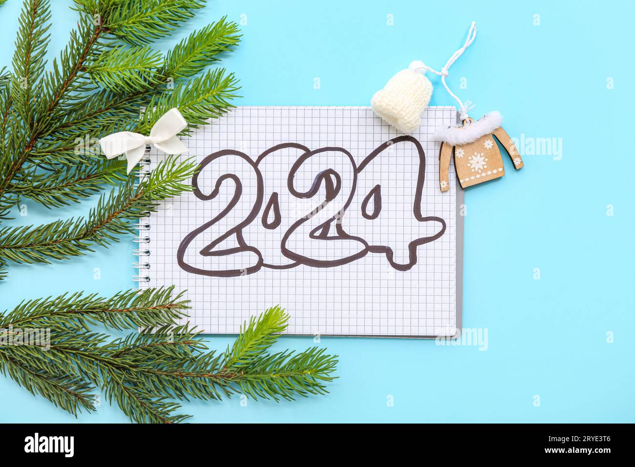 Notebook with written numbers 2024, Christmas decorations and fir ...