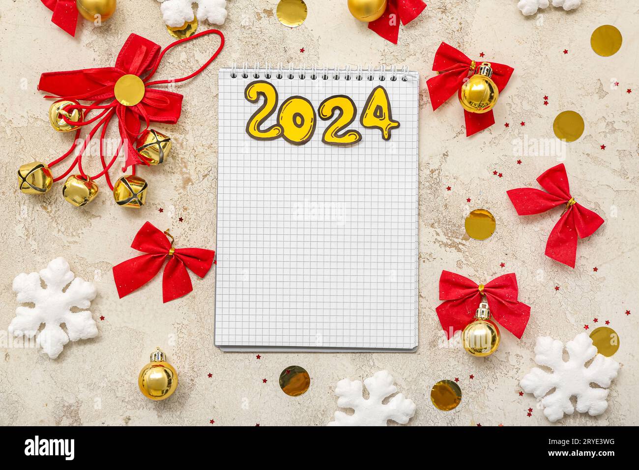 Composition with notebook, paper numbers 2024 and Christmas decorations ...