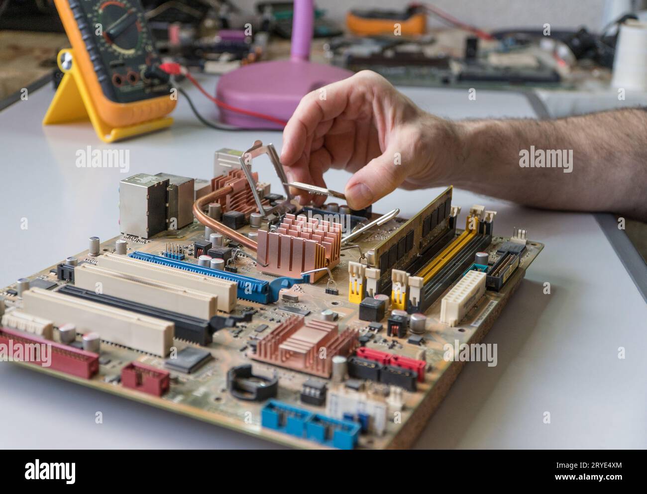 Master repairs chip Stock Photo - Alamy