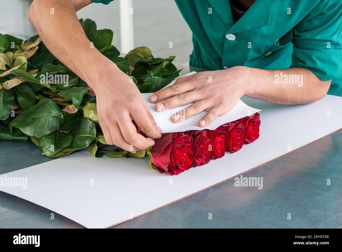 Flowers packaging process Stock Photo - Alamy