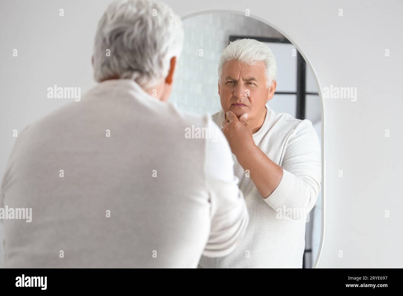 Elderly man back view mirror hi-res stock photography and images - Alamy