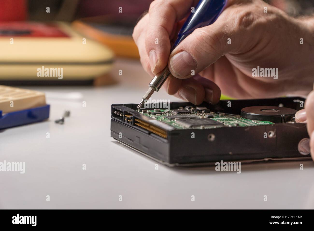 Master repairs chip Stock Photo - Alamy