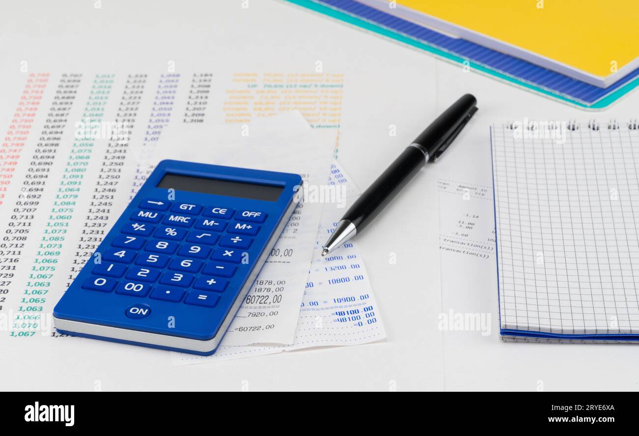 Store receipt and calculator Stock Photo - Alamy