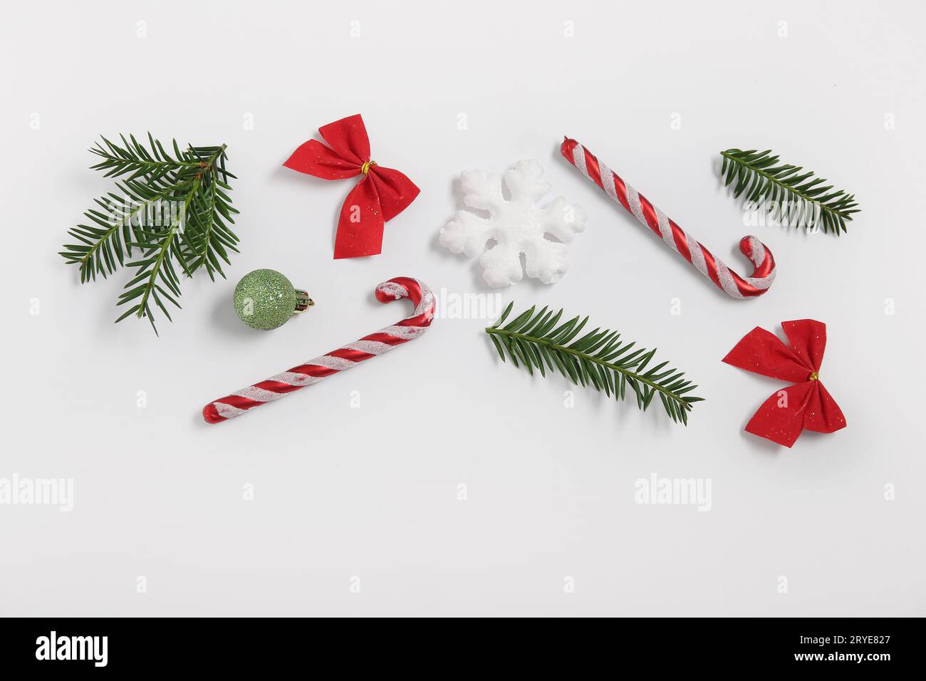 Candy canes, fir branches and Christmas decorations on white background Stock Photo - Alamy