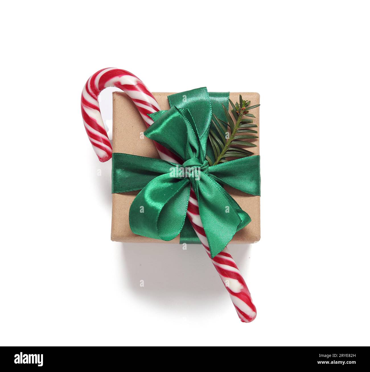 Beautiful gift box with candy cane on white background Stock Photo - Alamy