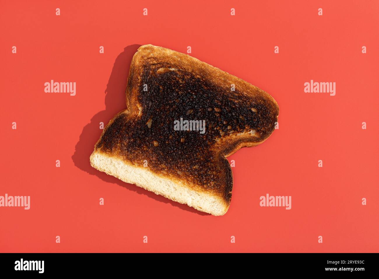 Dark Burned Sandwich Bread Isolated on red Background Stock Photo - Alamy