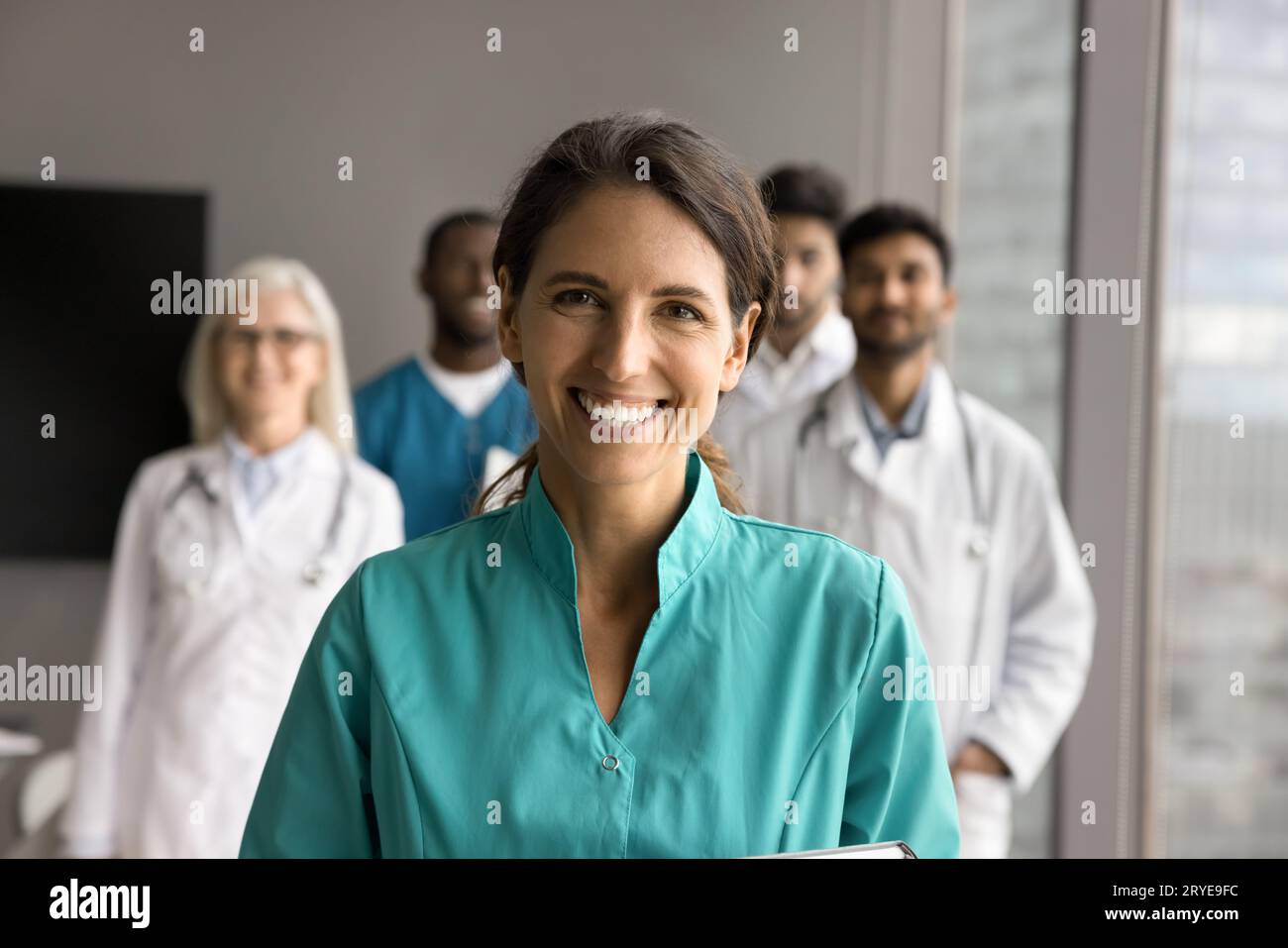 Happy pretty Latin surgeon doctor woman head shot portrait Stock Photo ...
