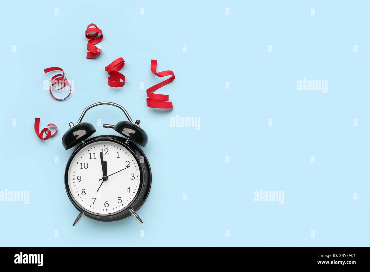 Composition with alarm clock and serpentine on color background Stock ...