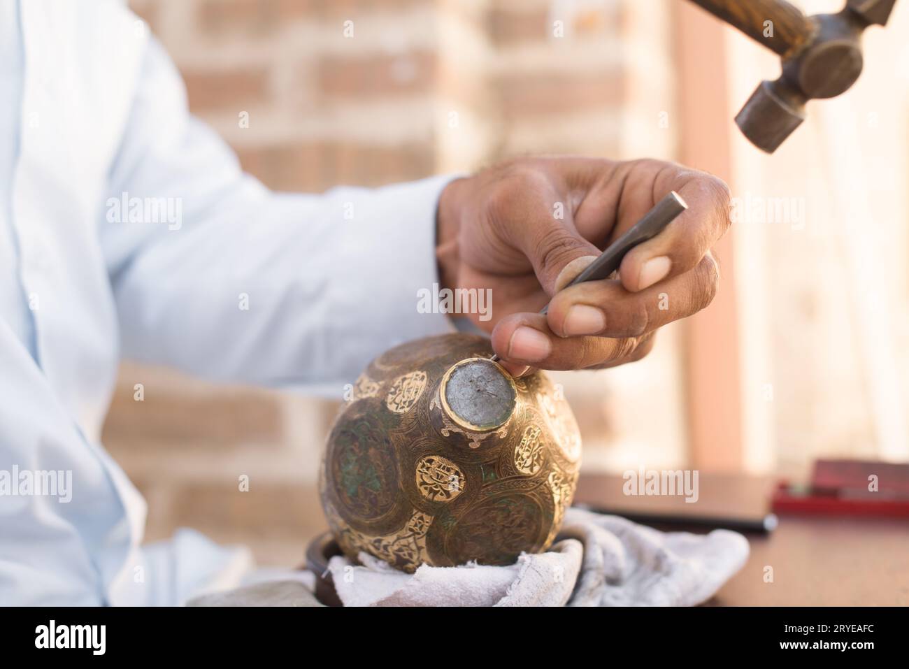 Chaser of copper at work Stock Photo - Alamy