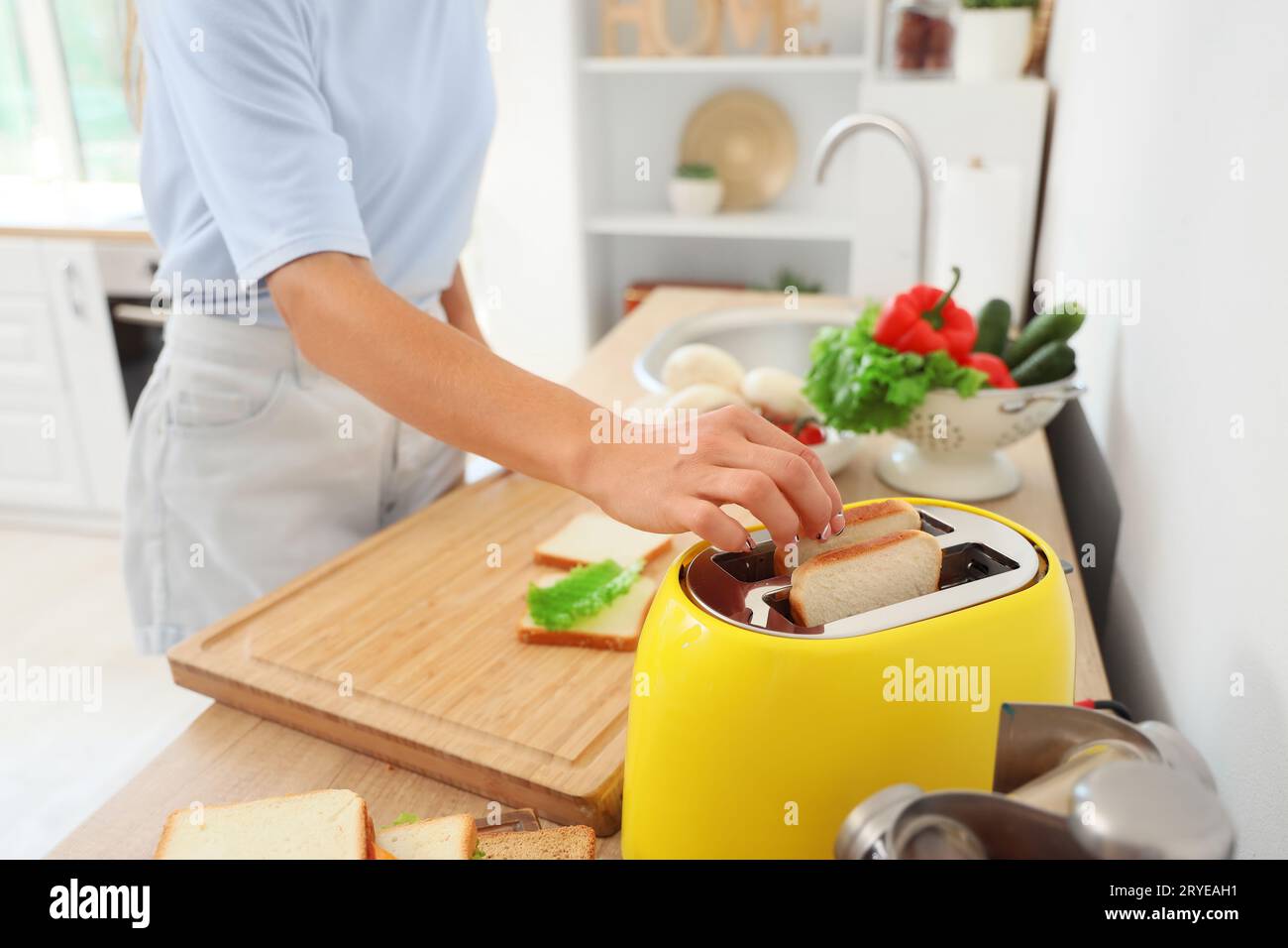 Toaster in kitchen making toasts hi-res stock photography and images ...