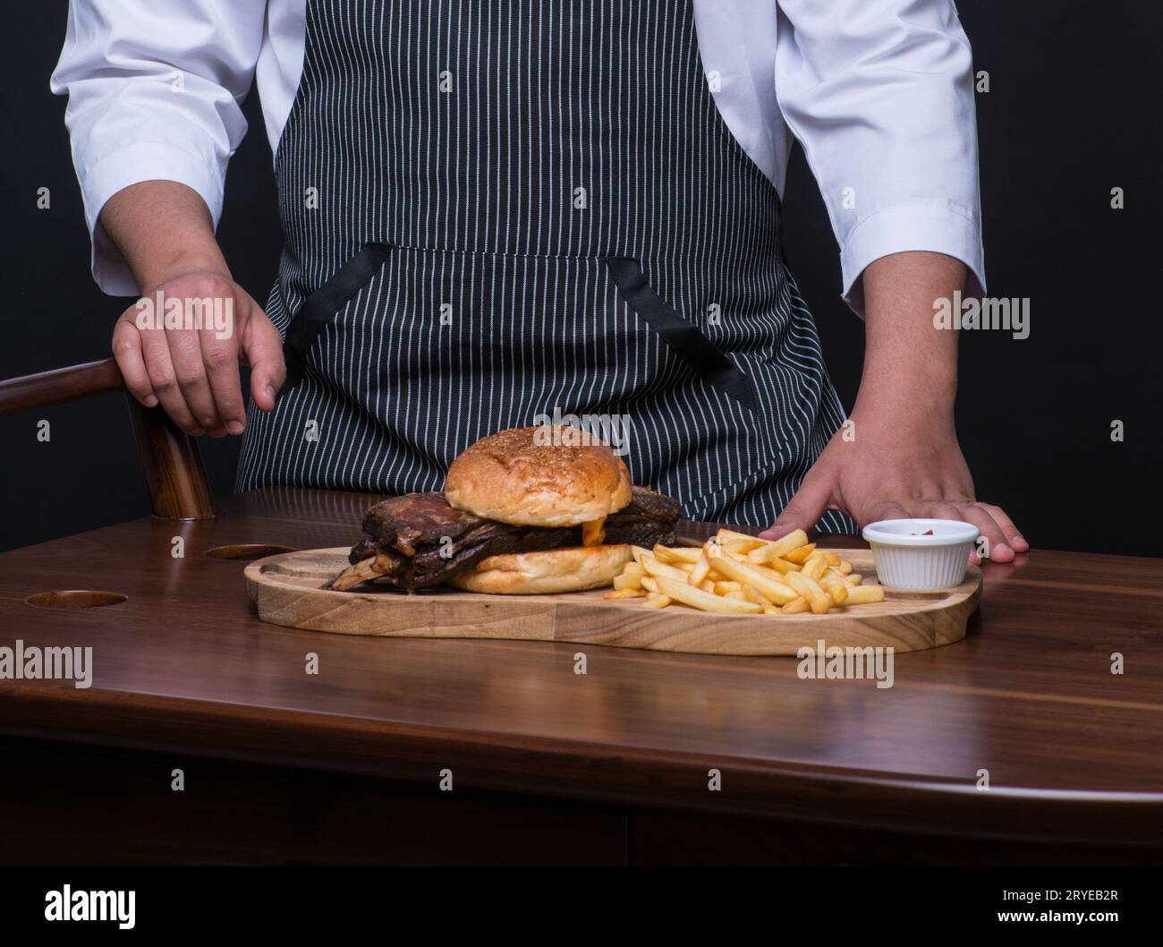 The chef serves the dish Stock Photo - Alamy