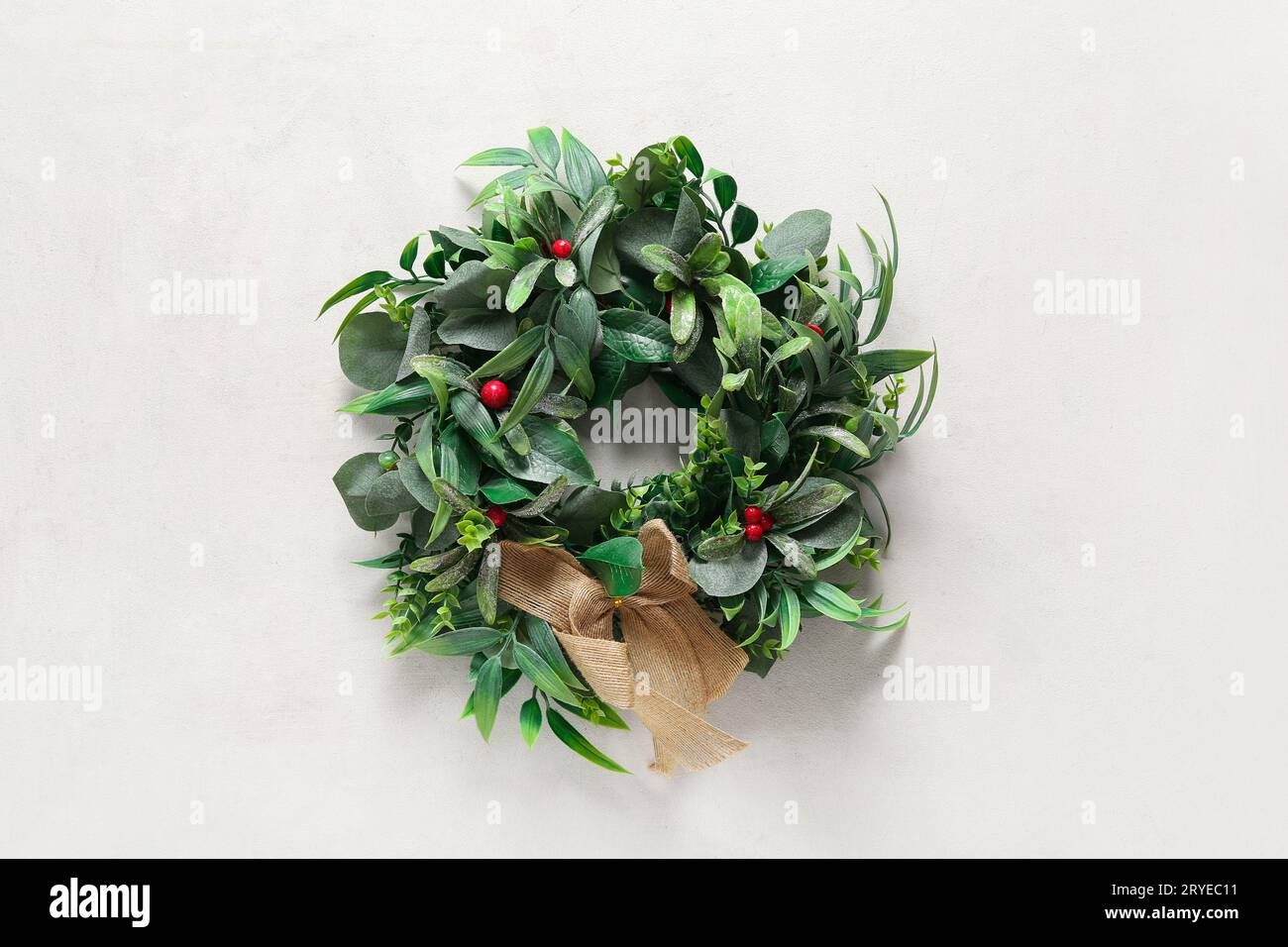 Beautiful mistletoe wreath on white background Stock Photo - Alamy