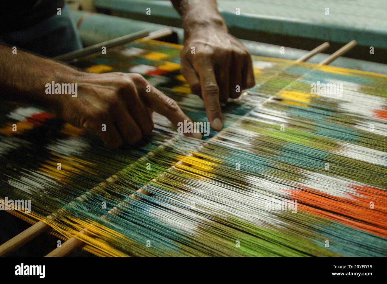 Production and weaving of carpets and fabrics Stock Photo - Alamy