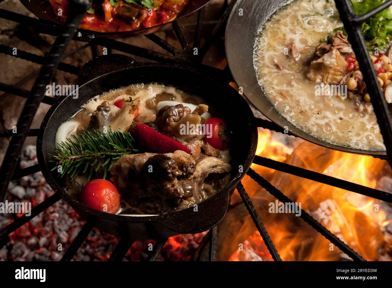 Cooking on fire Stock Photo - Alamy