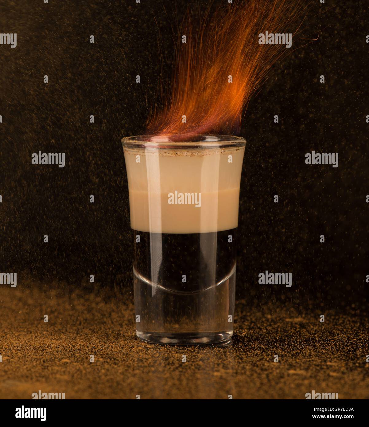 Shot glass with alcohol on a dark background Stock Photo - Alamy