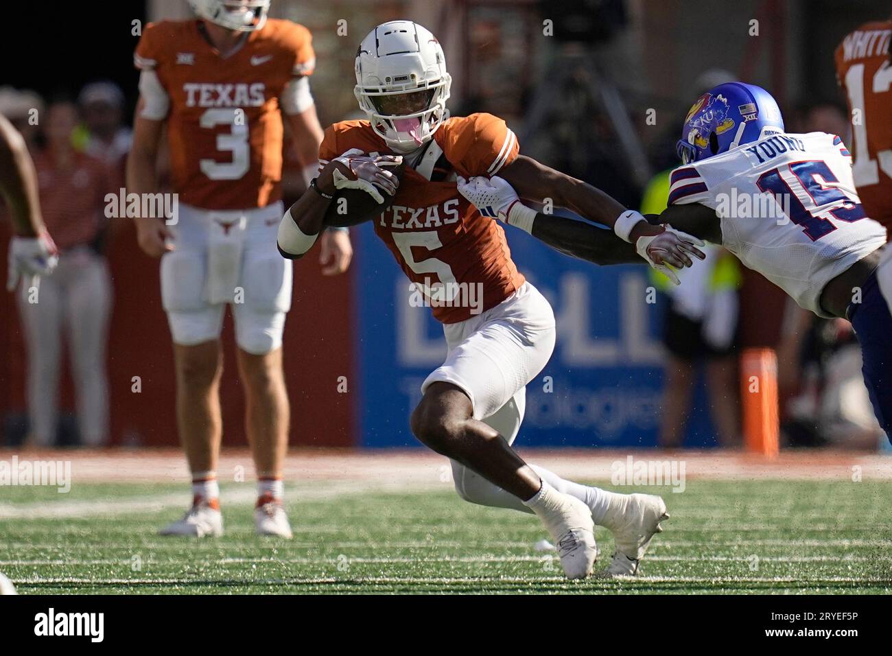 Texas wide receiver Adonai Mitchell (5) runs past Kansas linebacker ...