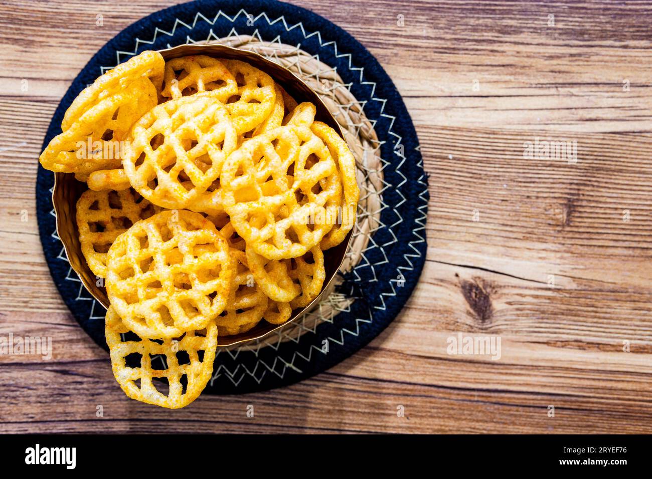 bowl of fried crisps healthy food choices on a circular straw mat ...