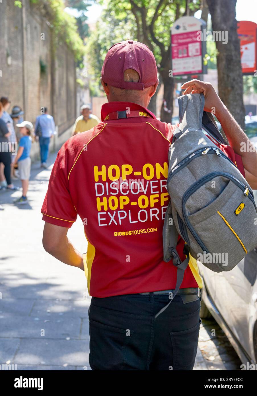 Hop on hop off bus worker on duty at the bus stop in Rome Stock Photo ...
