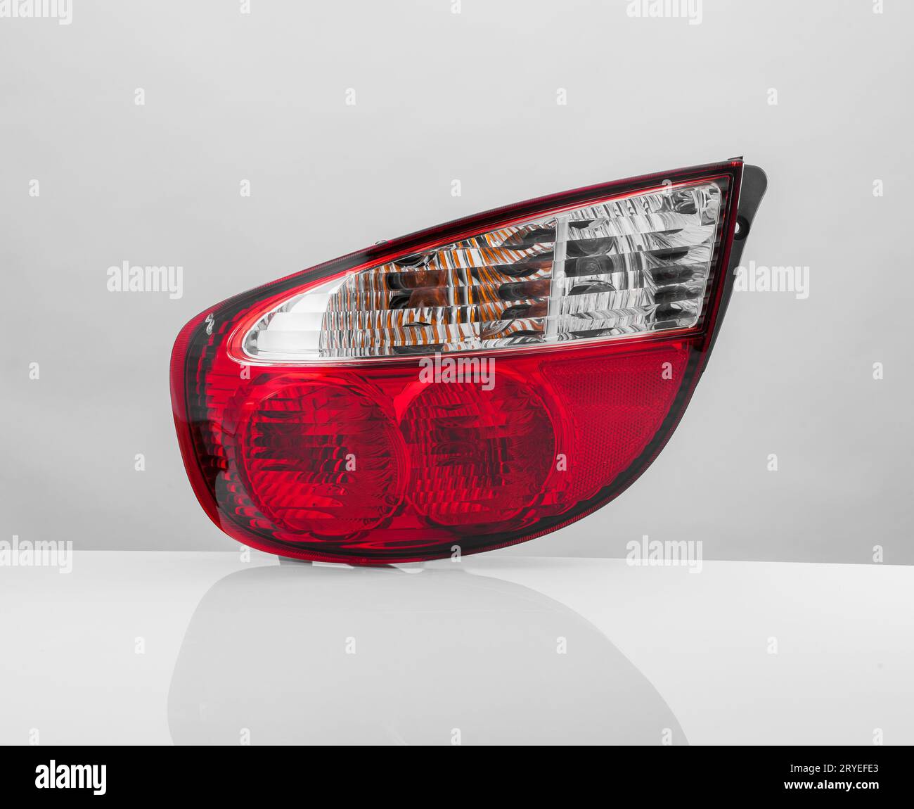 A car headlight on white background with reflection Stock Photo - Alamy