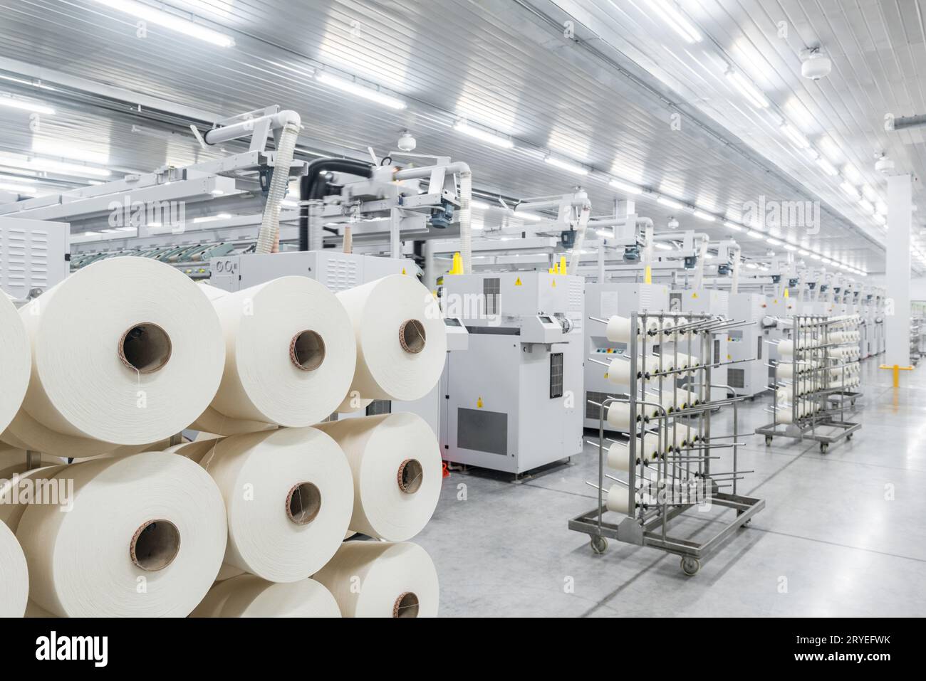 Production of threads in a textile factory Stock Photo - Alamy