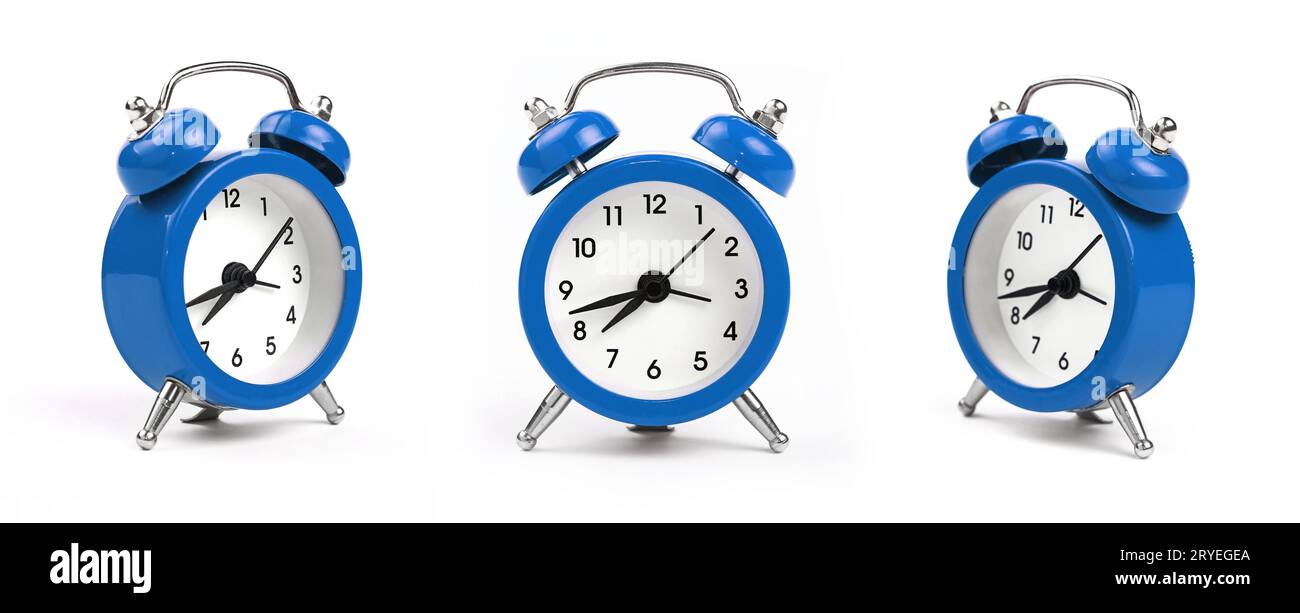 Three blue alarm clock over white Stock Photo - Alamy