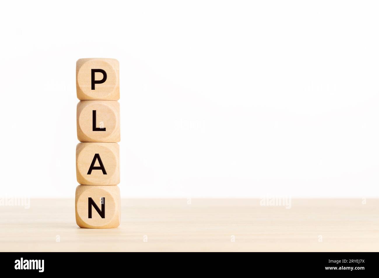 Plan concept. Wooden block with text on table Stock Photo - Alamy