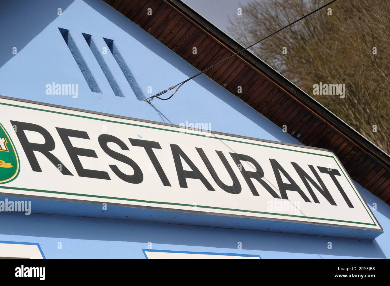 Restaurant sign on a building Stock Photo - Alamy