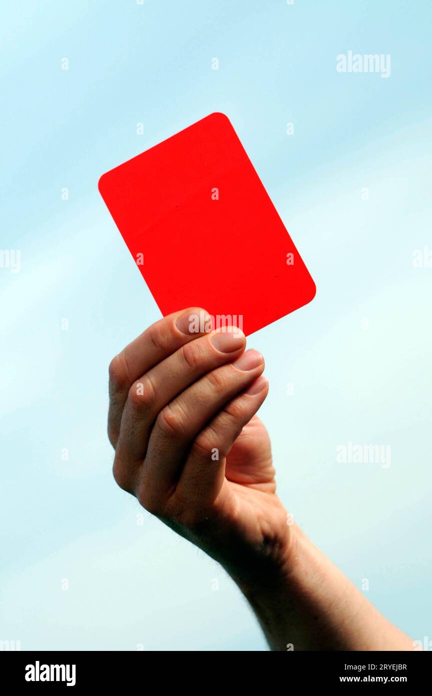 Holding up the red card Stock Photo - Alamy
