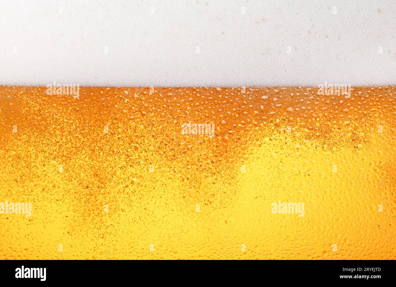 Close up background of beer with bubbles in glass Stock Photo - Alamy